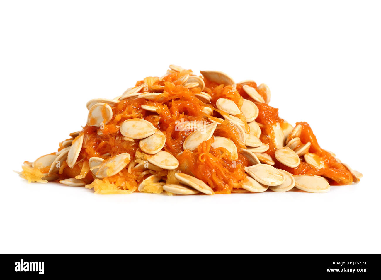 Seeds and pulp of pumpkin. Isolated on white background Stock Photo - Alamy