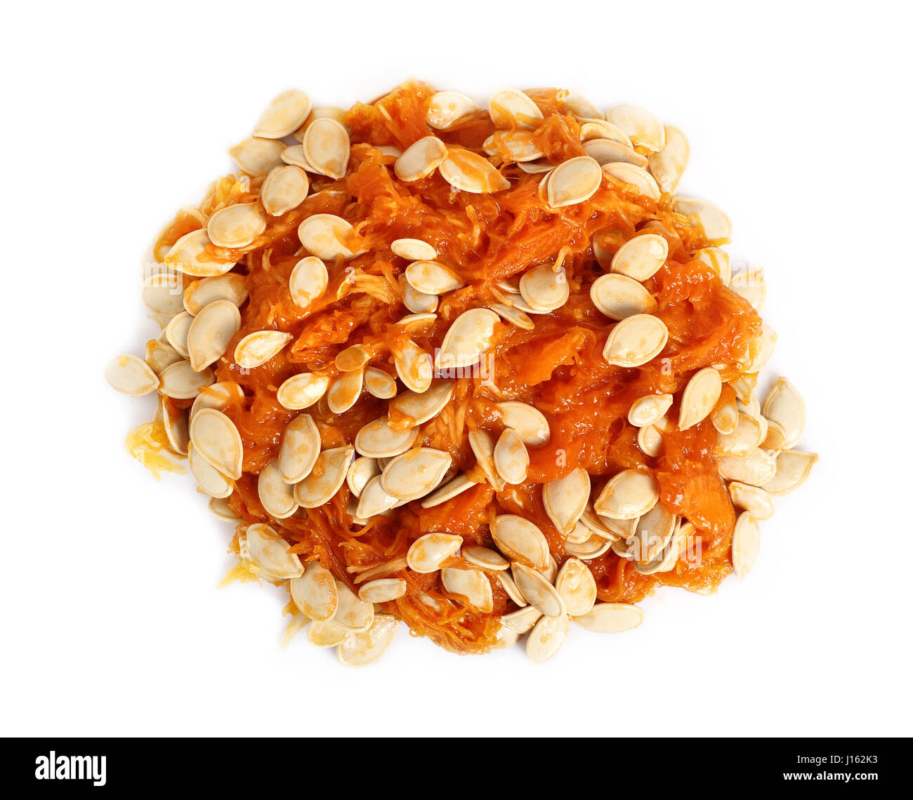 Seeds and pulp of pumpkin. Isolated on white background Stock Photo - Alamy