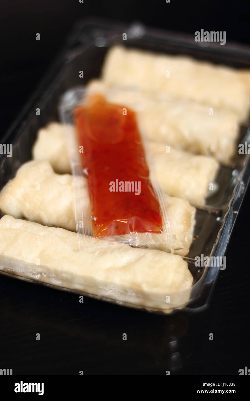Spring roll in disposable plastic tray Stock Photo - Alamy