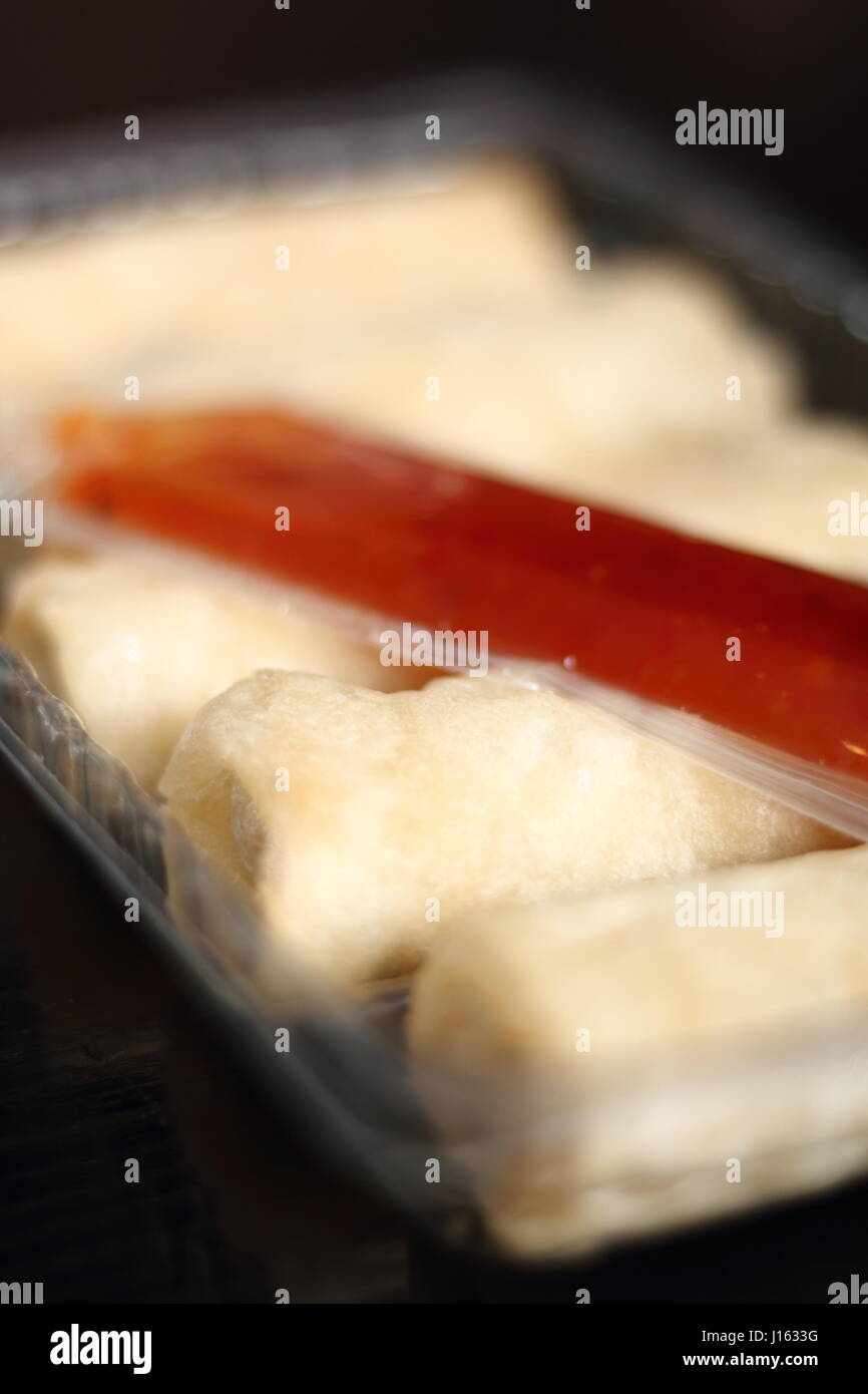 Spring roll in disposable plastic tray Stock Photo - Alamy