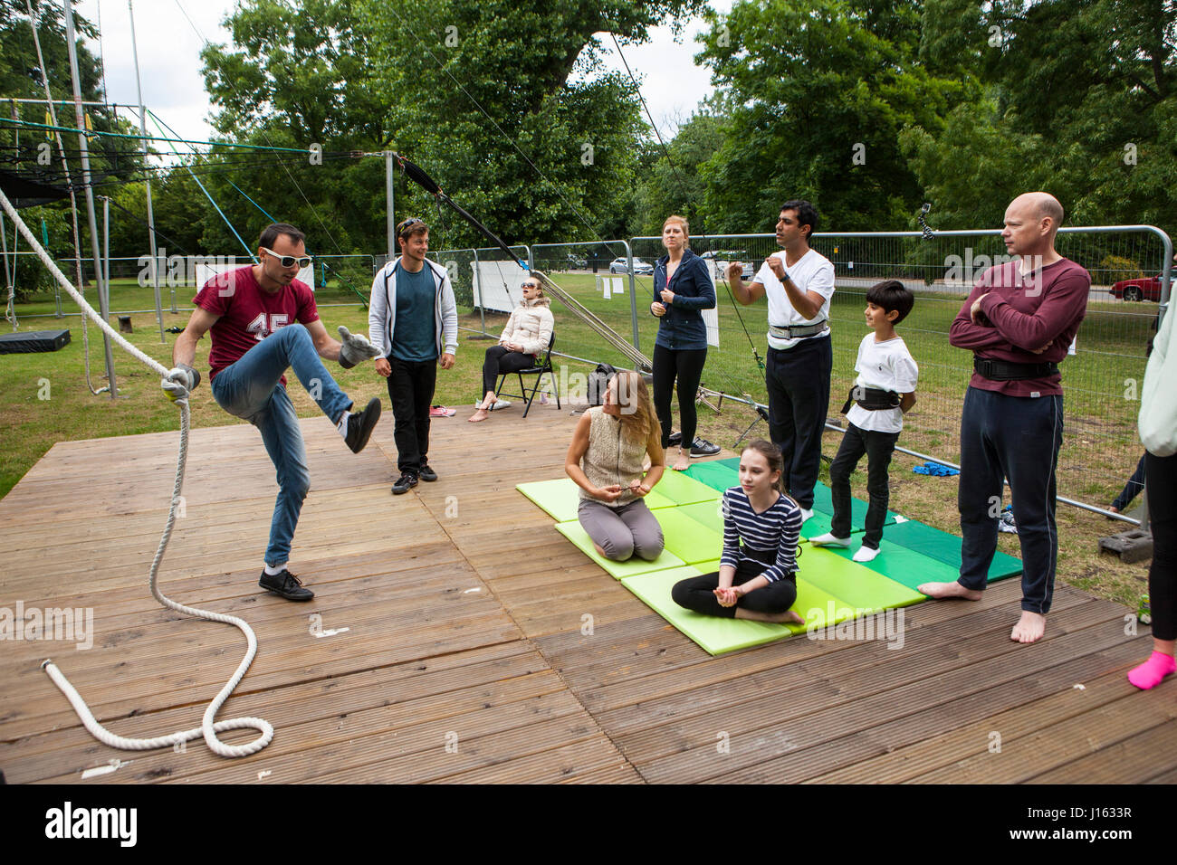 Ben Sobel, trapeze instructor, gives the students pointers for the ...