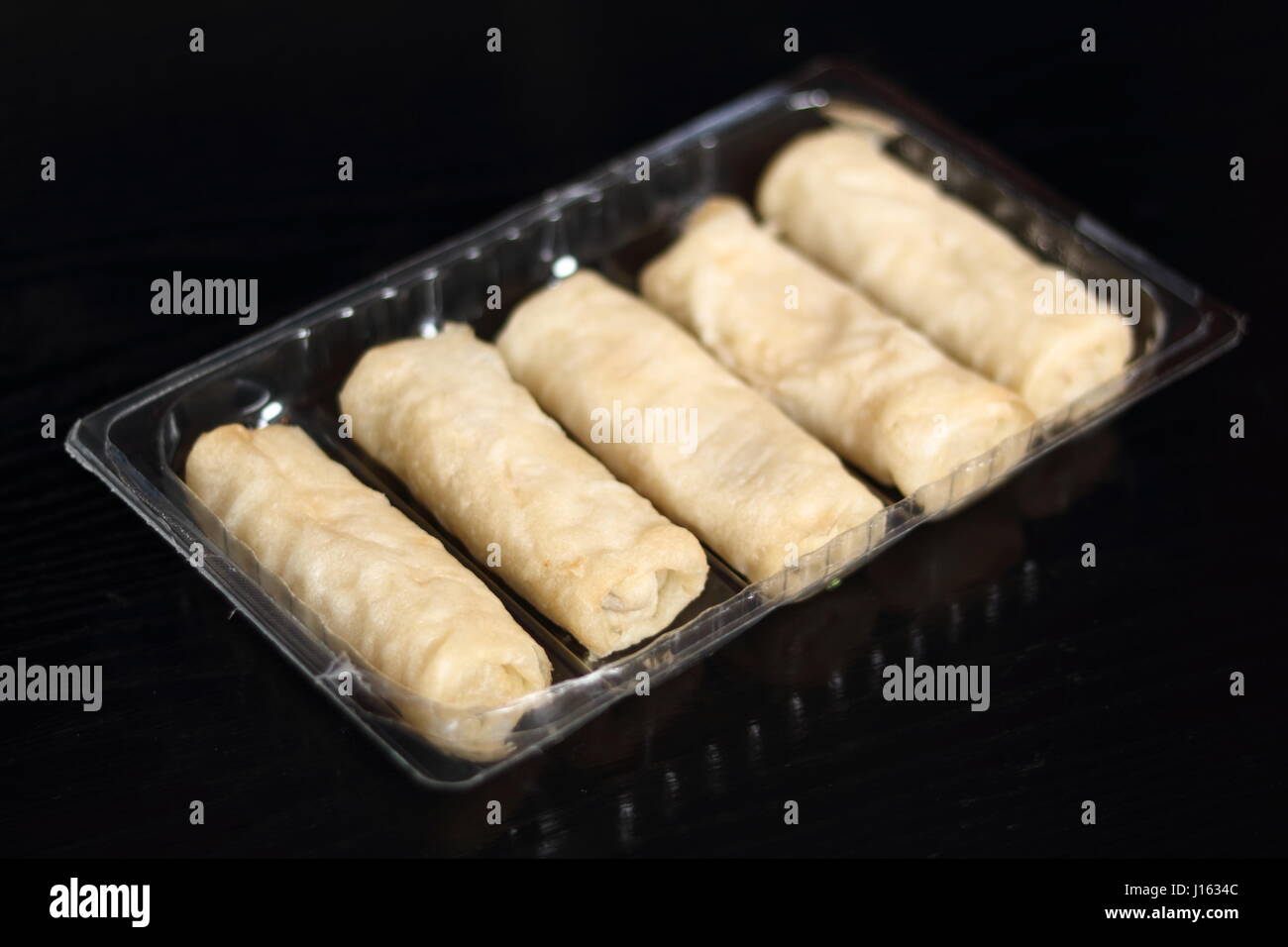Spring roll in disposable plastic tray Stock Photo - Alamy