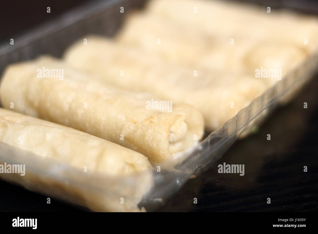 Spring roll in disposable plastic tray Stock Photo - Alamy