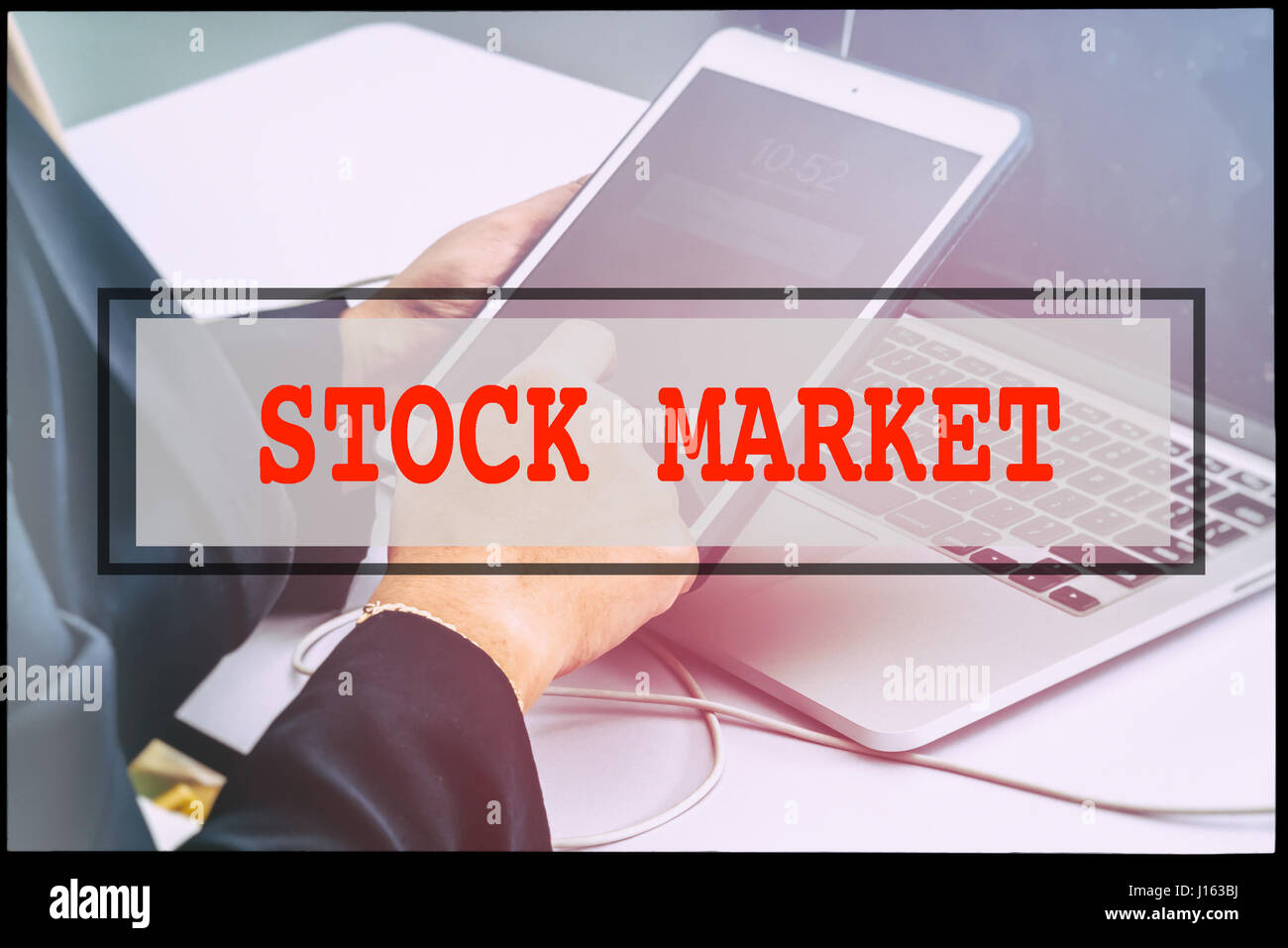 Hand and text STOCK MARKET with vintage background. Technology concept ...