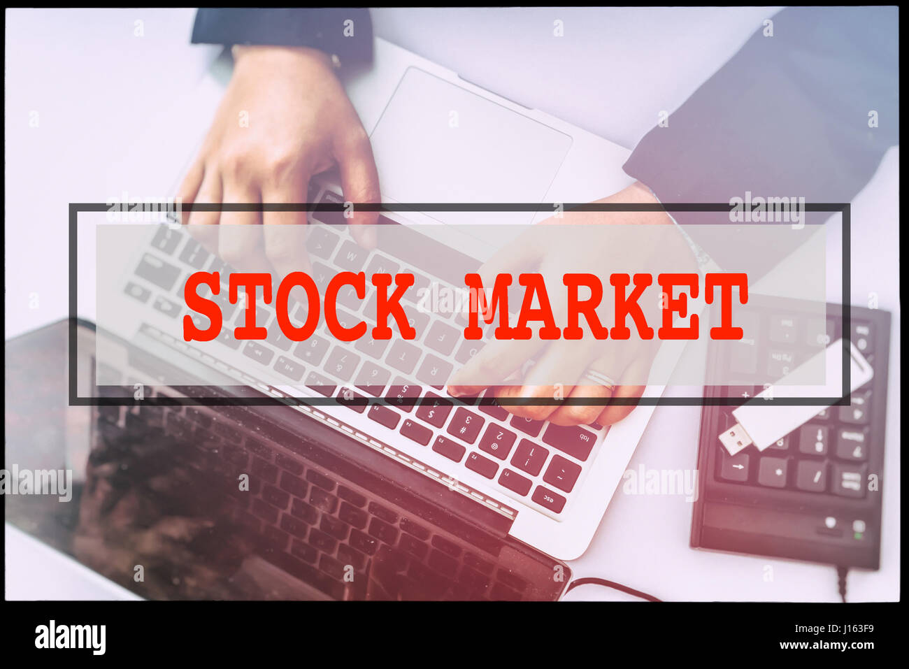 Hand and text STOCK MARKET with vintage background. Technology concept ...