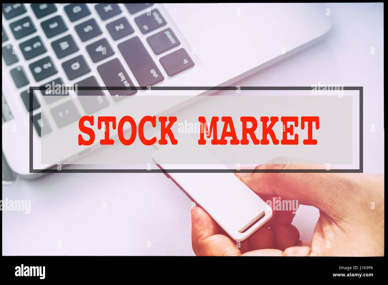 Hand and text STOCK MARKET with vintage background. Technology concept ...