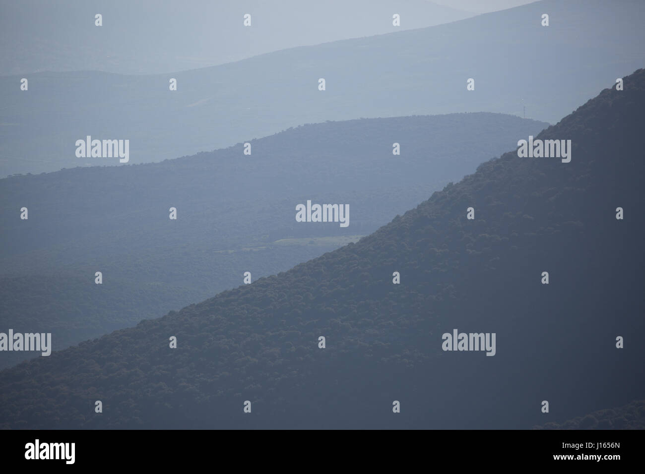 Distant hills covered with forest Stock Photo - Alamy
