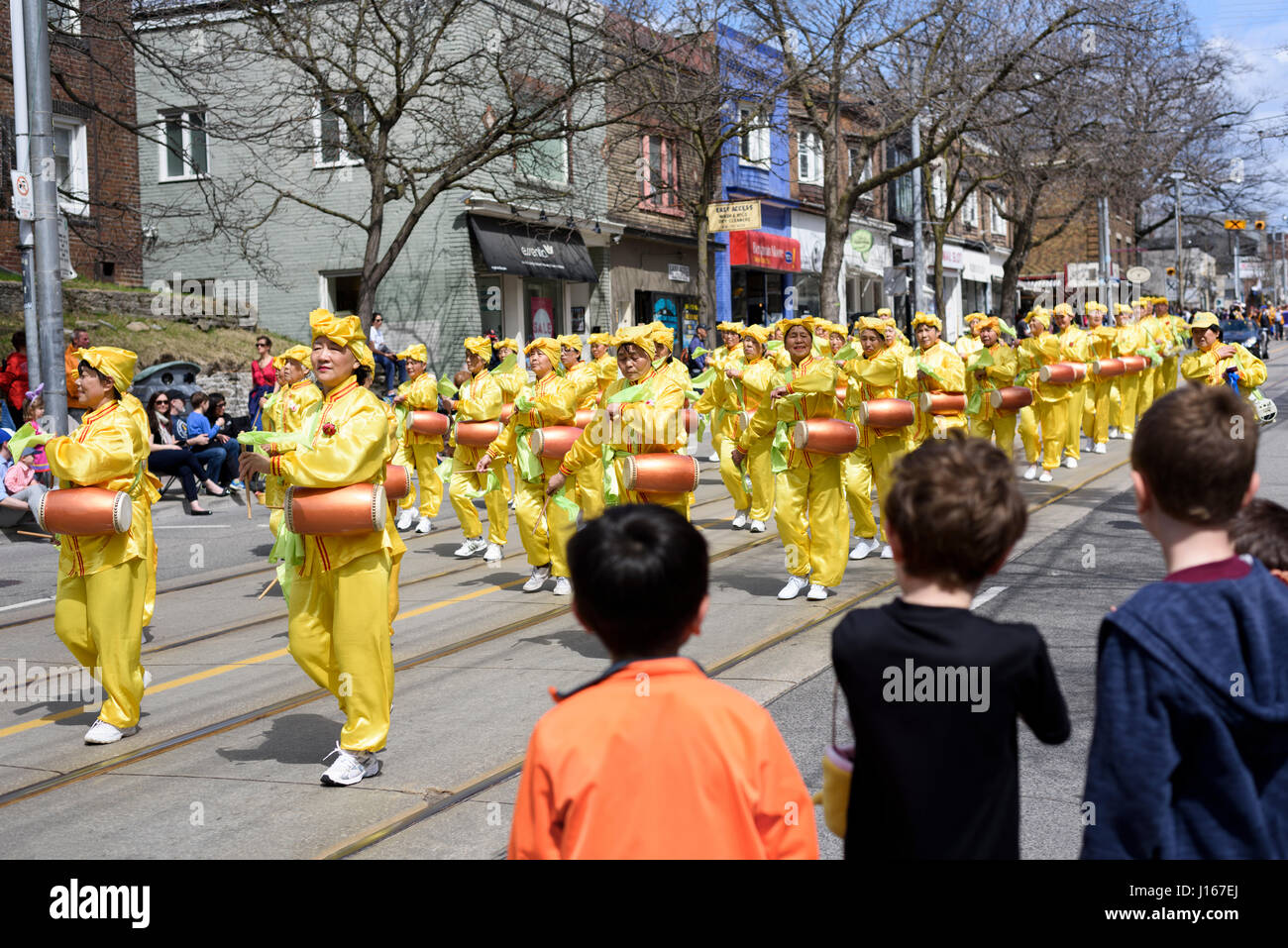 Falun Dafa marching group dressed in traditional Chinese costume play ...