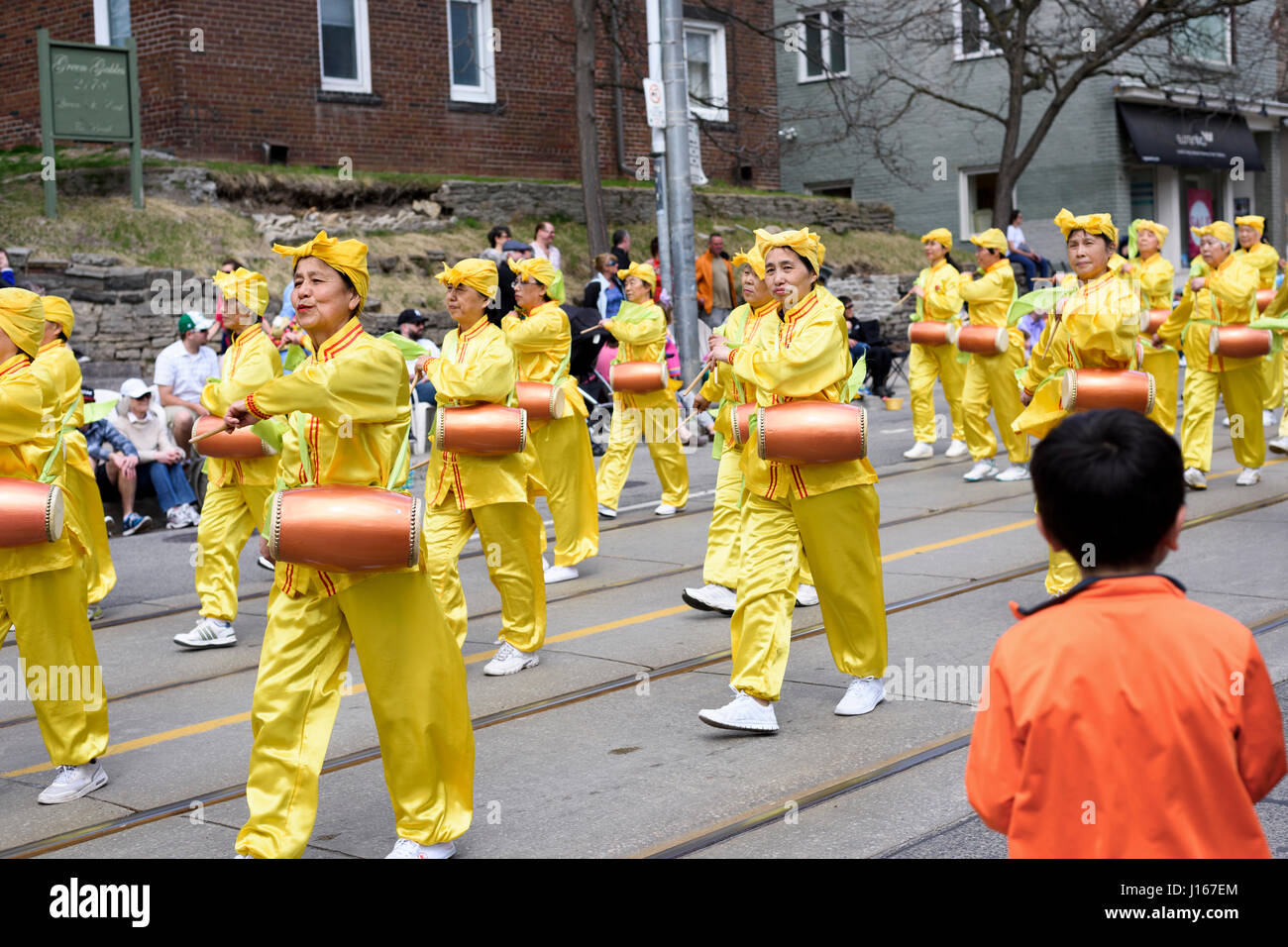Falun Dafa marching group dressed in traditional Chinese costume play ...