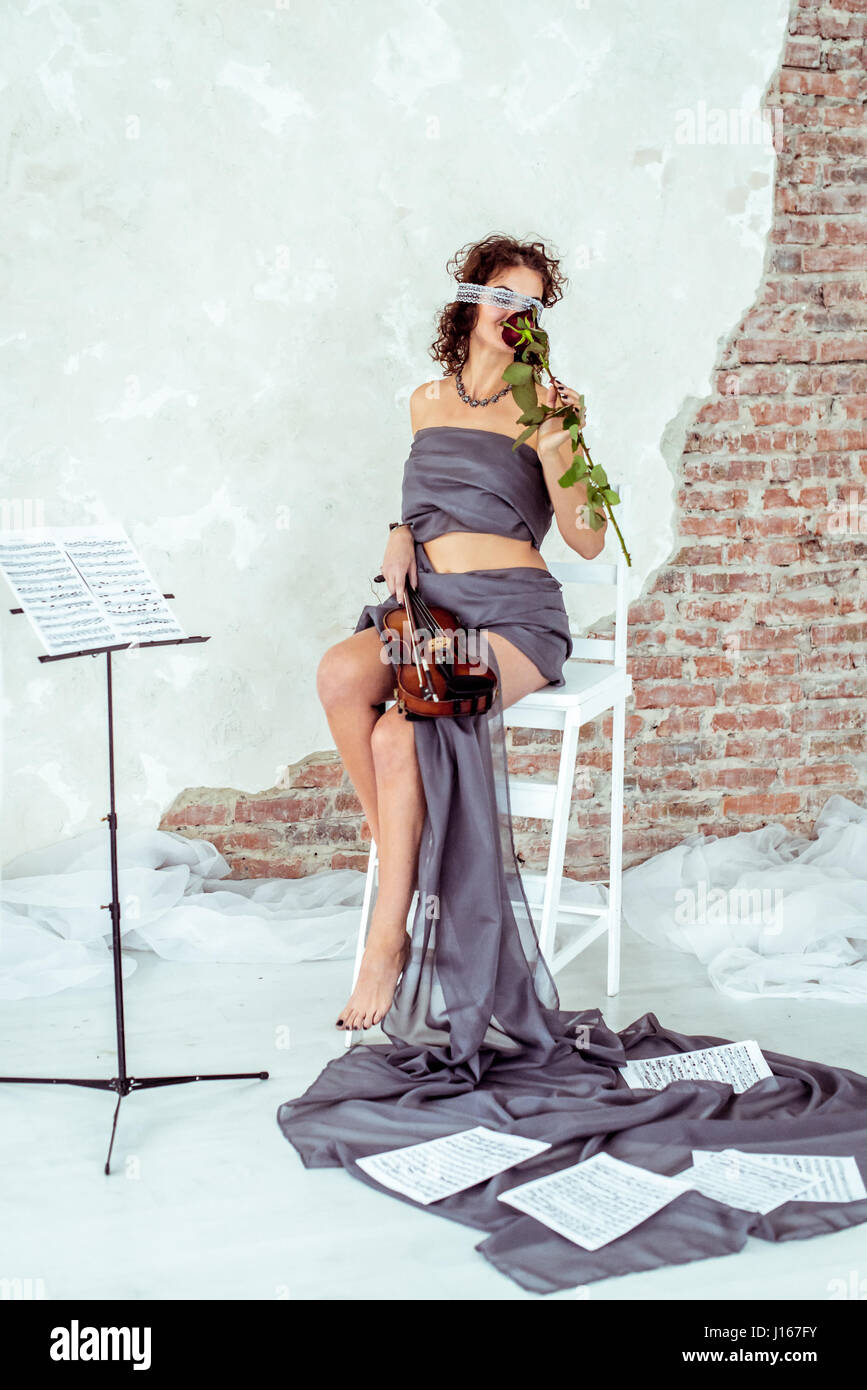 Lady holding stringed instrument hi-res stock photography and images ...