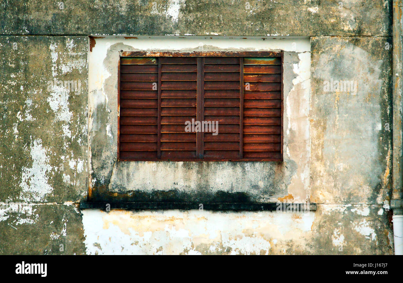 Rusty window on an old and textured wall Stock Photo - Alamy