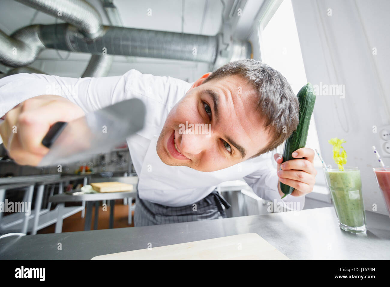 Young male chef having fun Stock Photo - Alamy