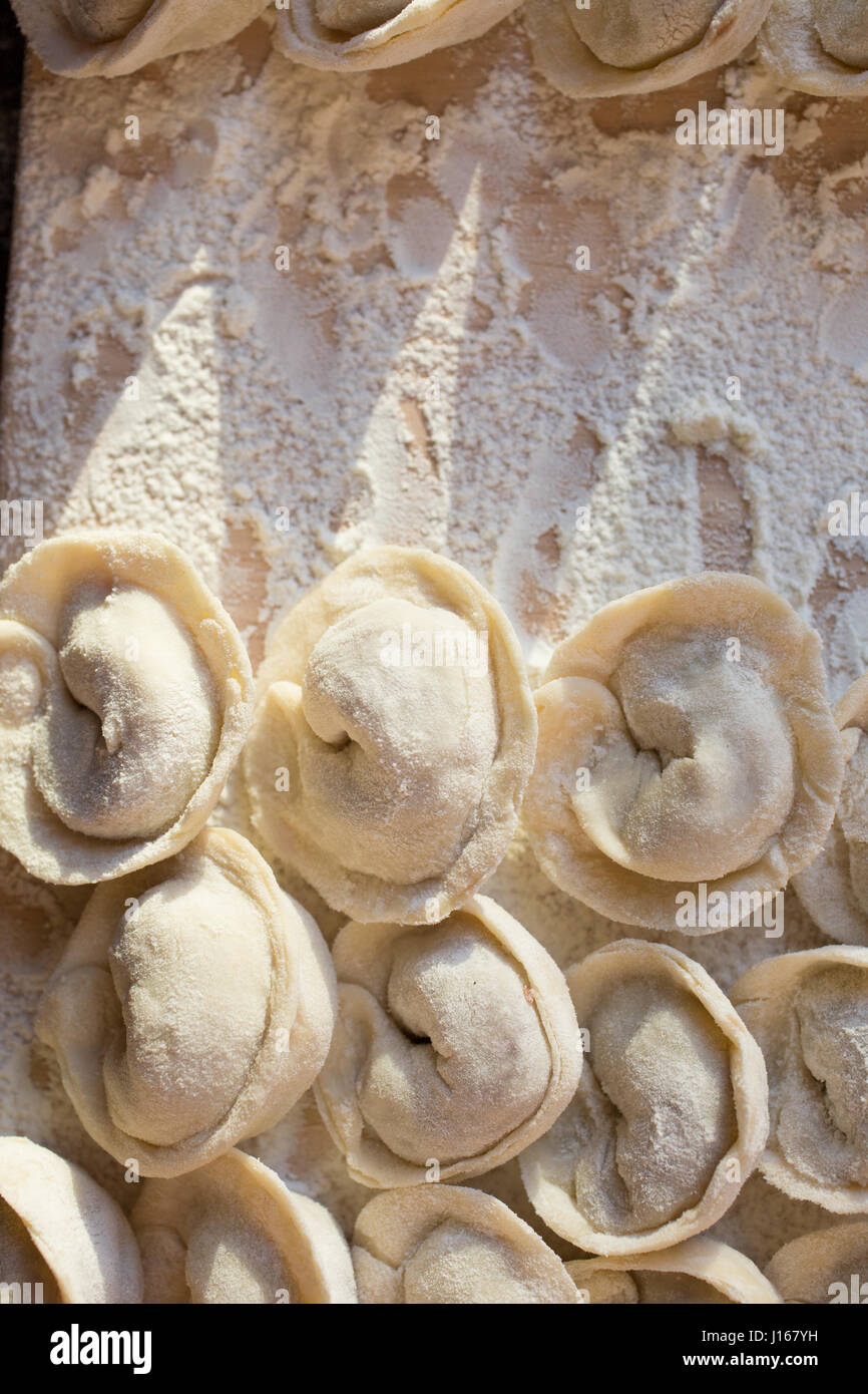 Rows of freshly made meat pockets Stock Photo - Alamy
