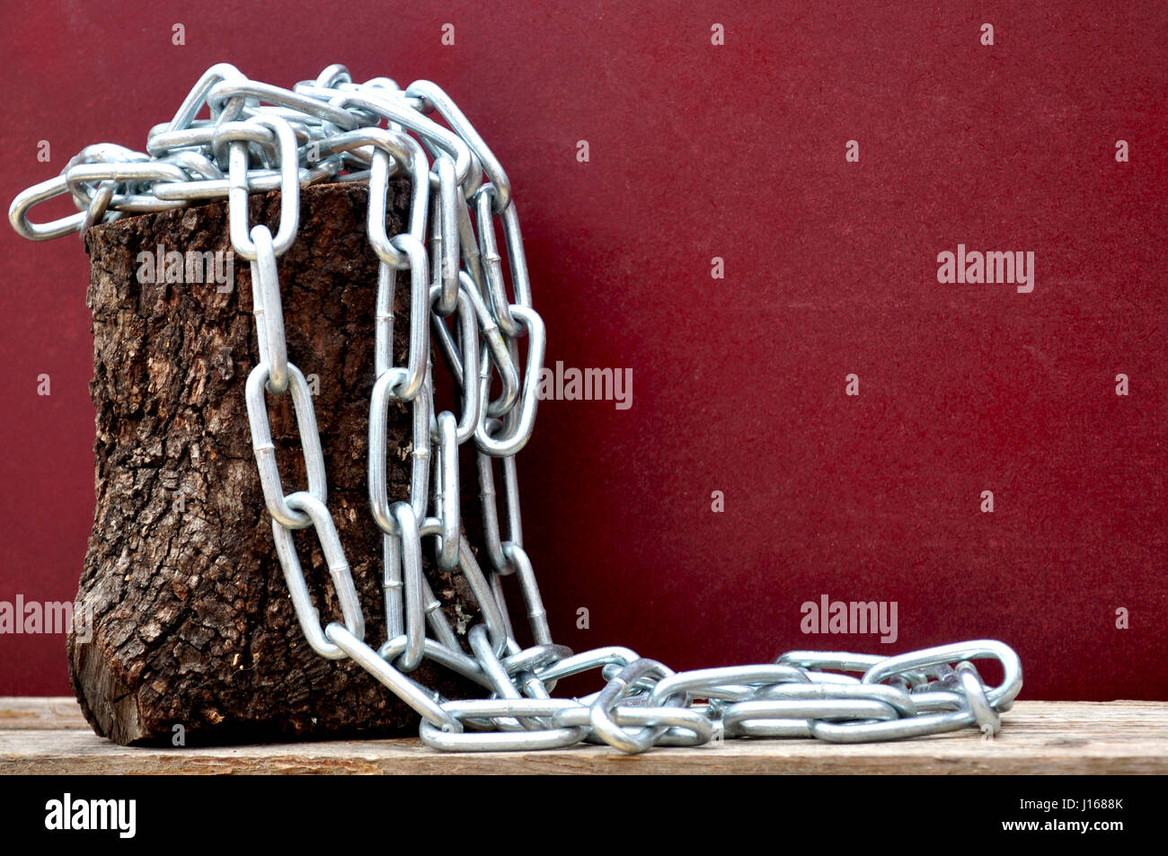 wood trunk and chain hanging Stock Photo - Alamy