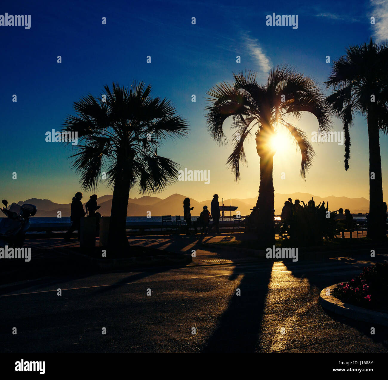 CANNES, FRANCE - 20 February, 2016: Dramatic winter sunset with blue ...