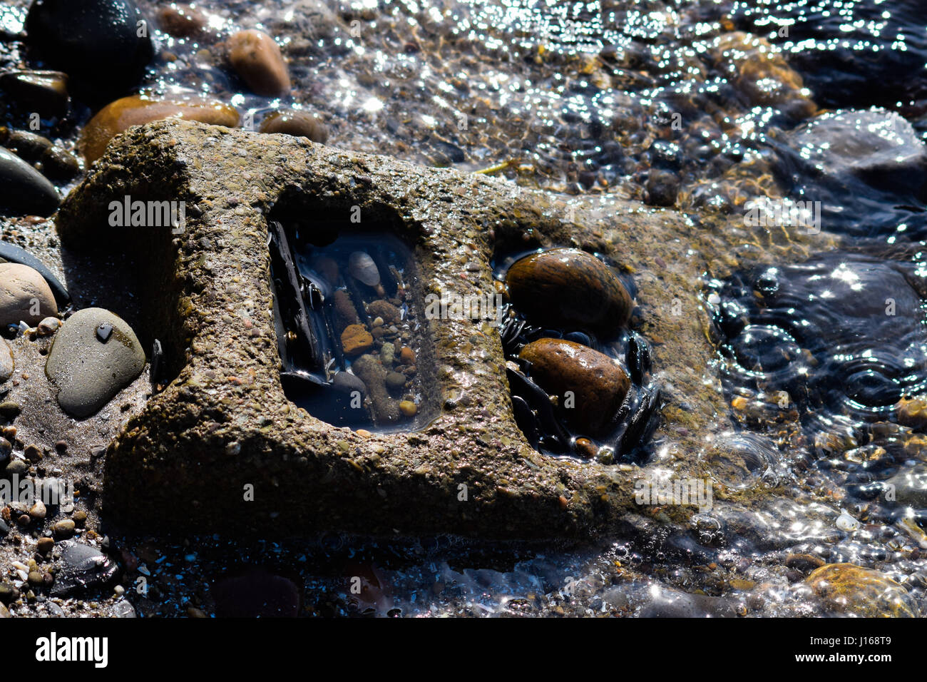 Cement Block In Water Stock Photo - Alamy