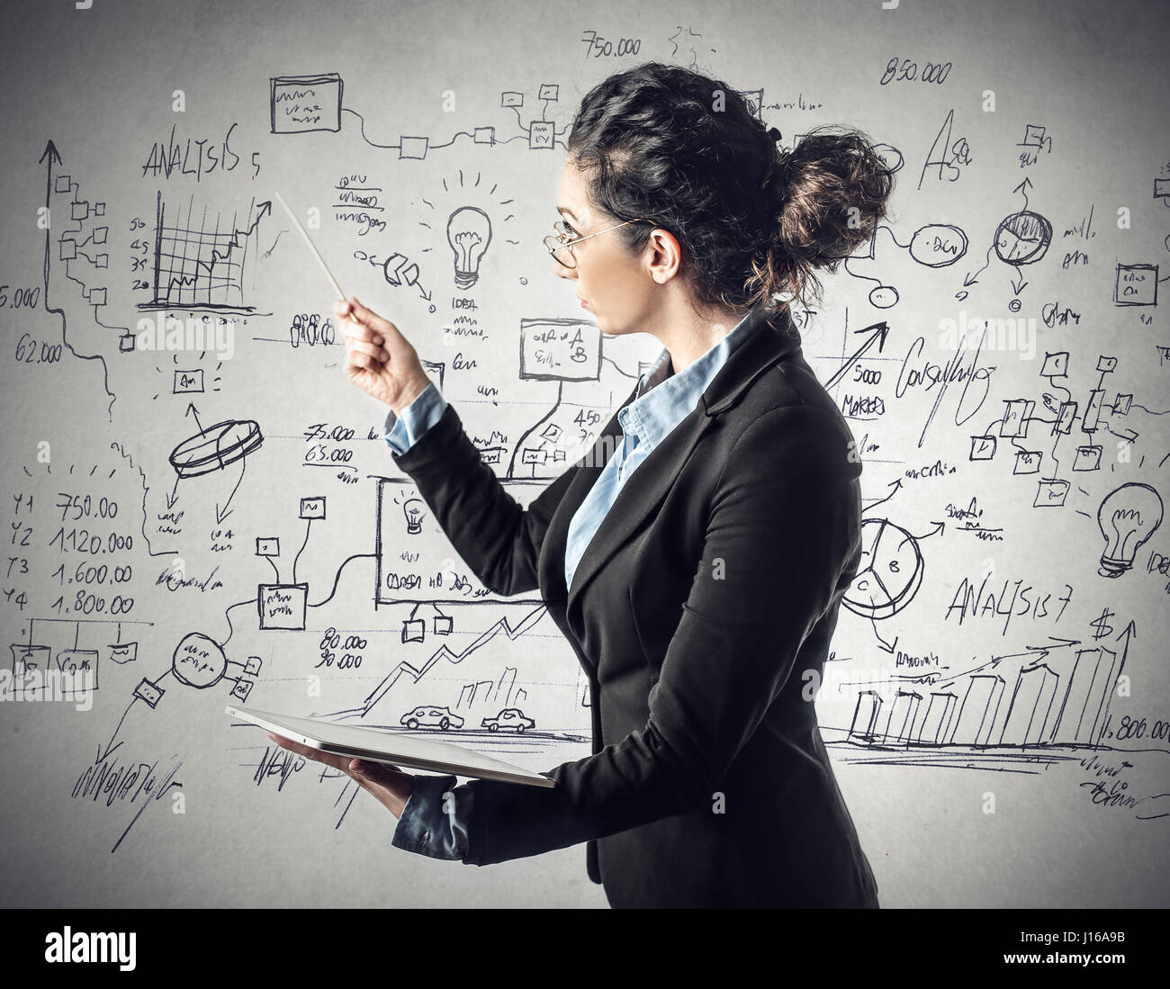 Businesswoman showing her plans Stock Photo - Alamy