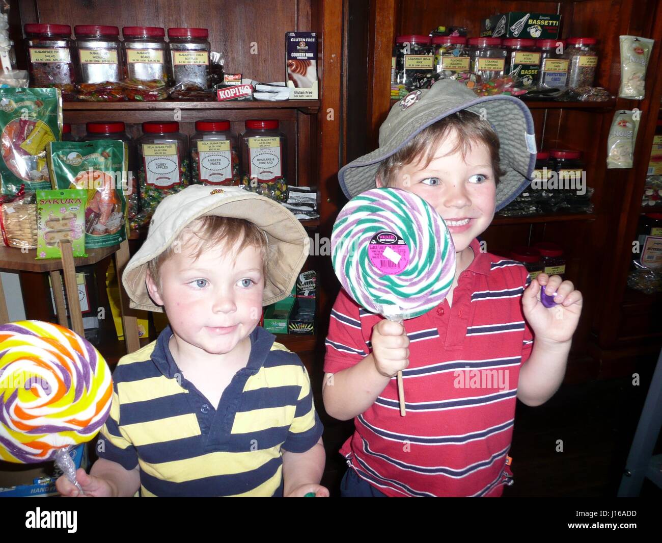 Two young boys in a Candy Store Stock Photo - Alamy