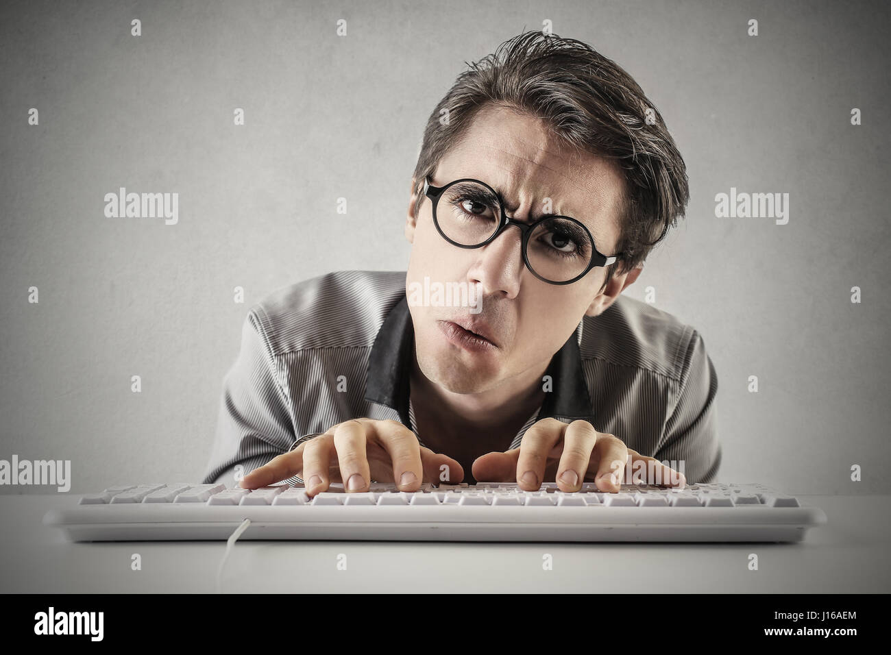 Businessman in front of computer Stock Photo - Alamy