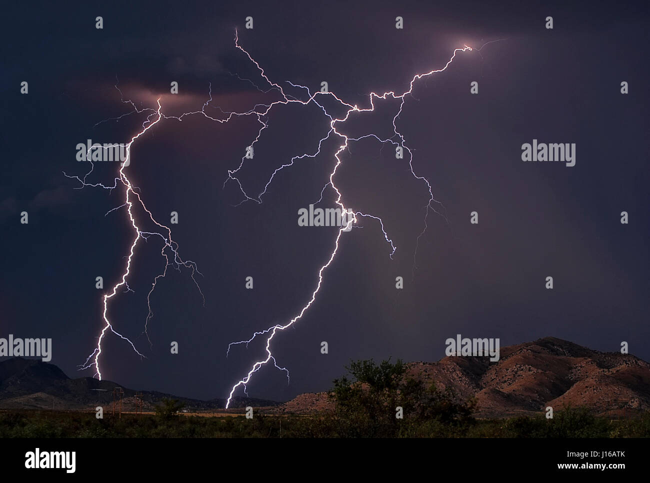 ARIZONA, USA: Lightning strikes over desert skyline. A TECHNICIAN’S ...