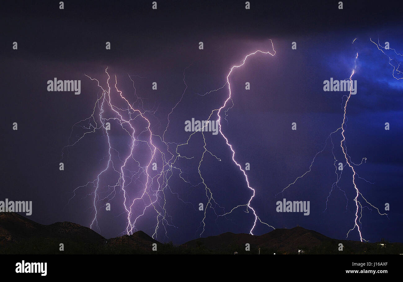 ARIZONA, USA: Lightning strikes over desert skyline. A TECHNICIAN’S ...