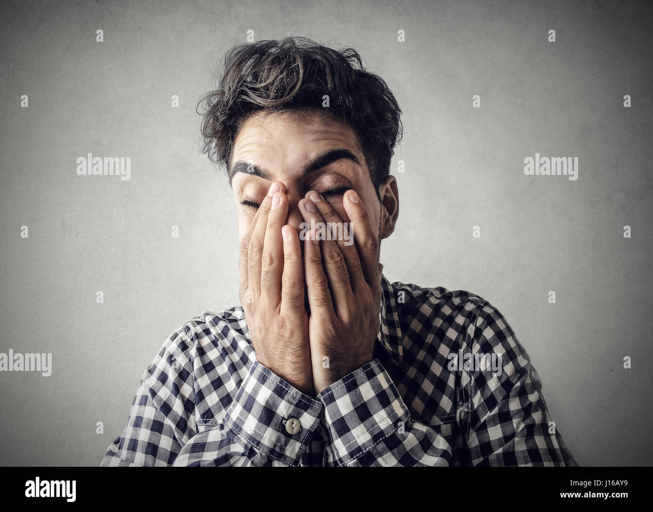 Handsome man being tired Stock Photo - Alamy
