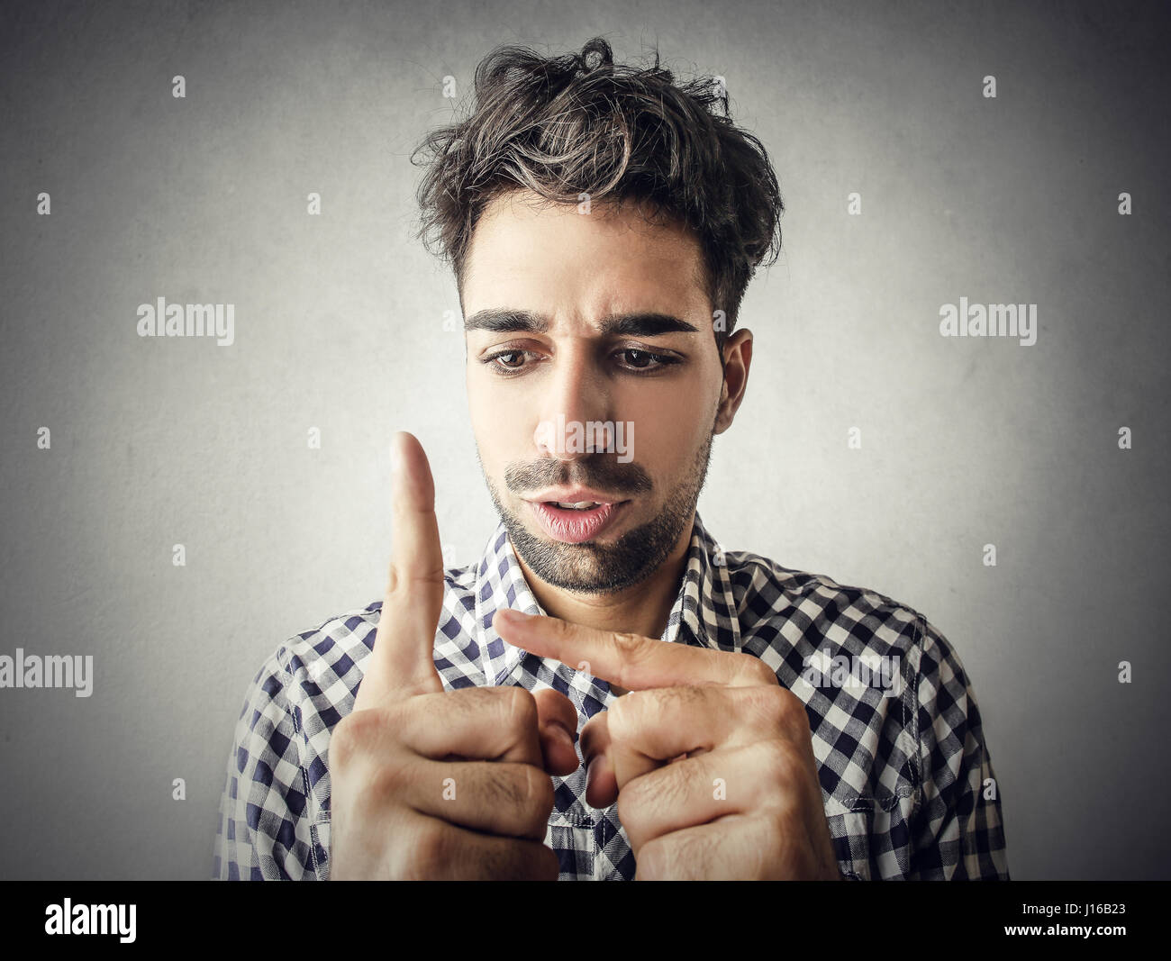 Handsome man counting Stock Photo - Alamy
