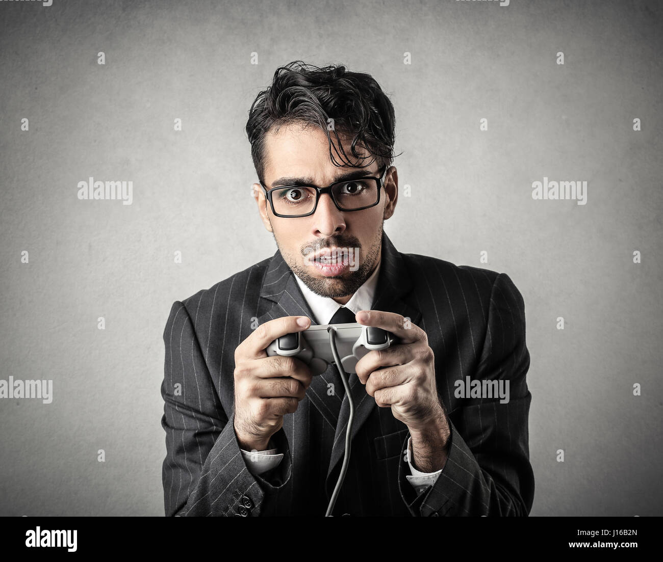 Businessman playing video game Stock Photo - Alamy