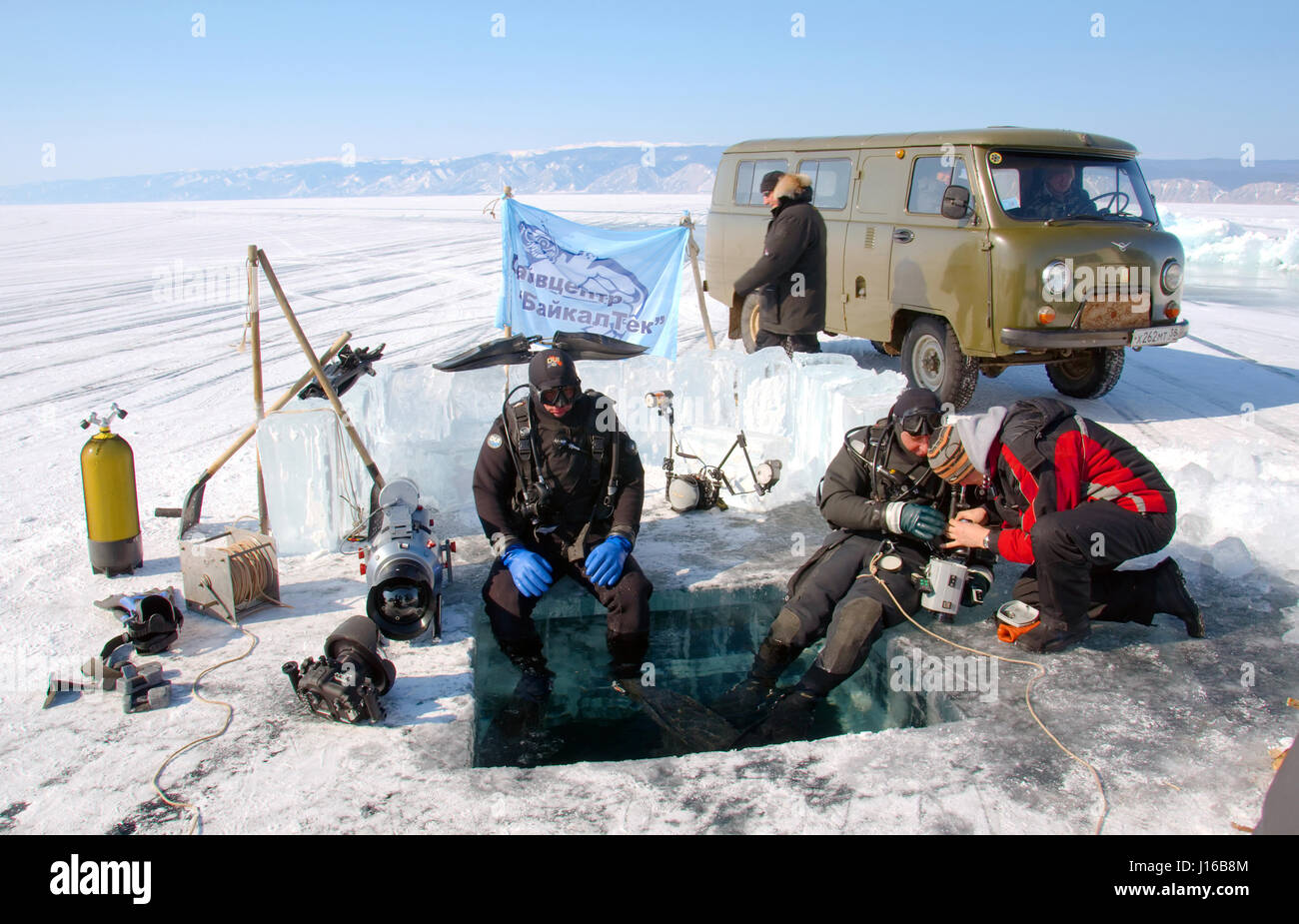SIBERIA: Ice divers prepare to descend, Lake Baikal. AN ICE-CUBED diver ...
