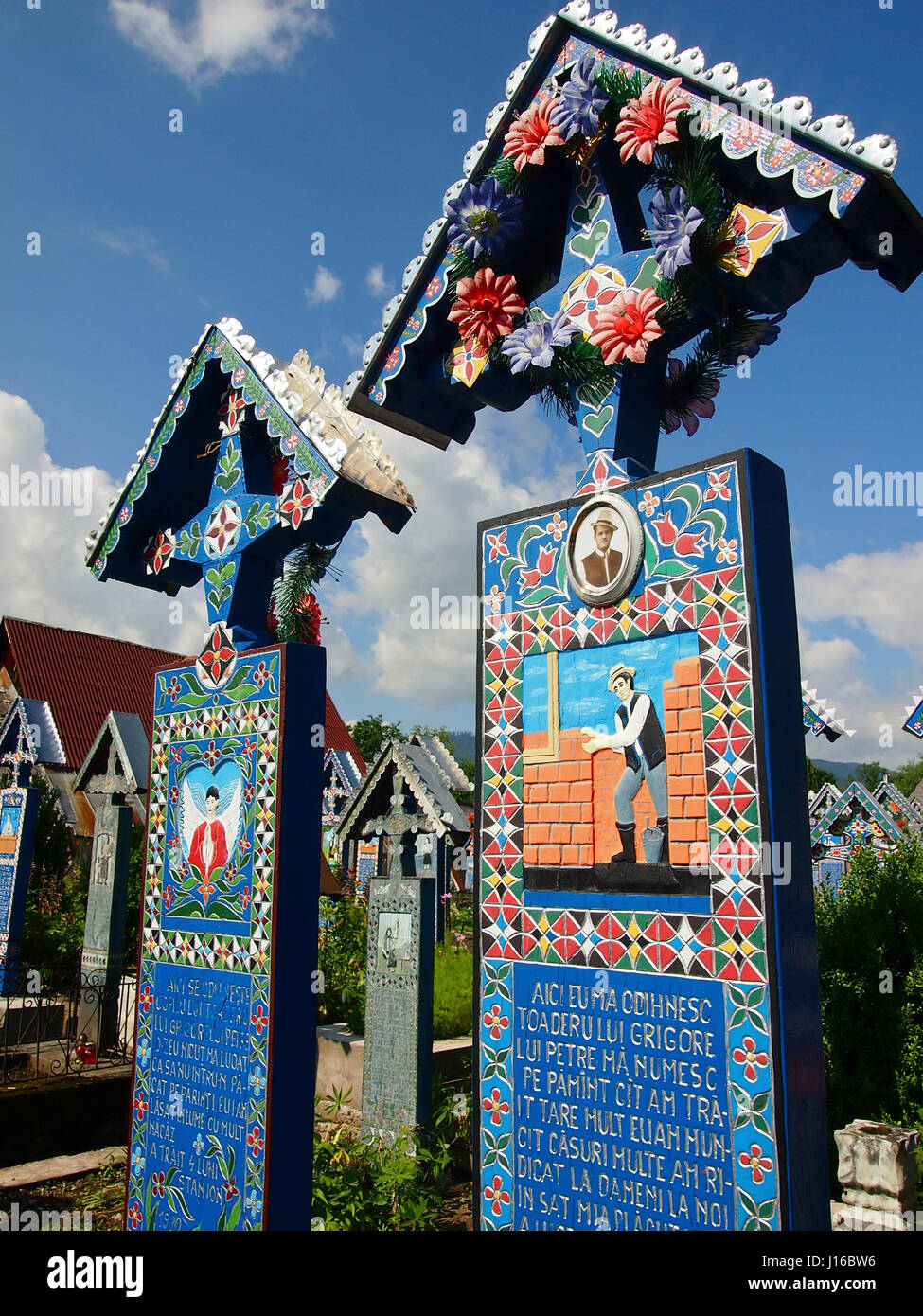 SAPANTA, ROMANIA: Bizarre headstones at the Merry Cemetery shows both ...