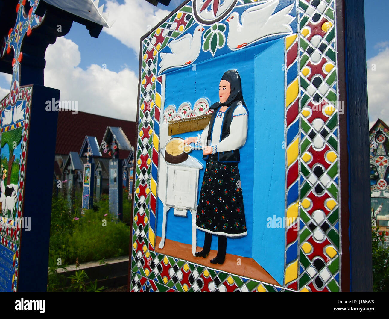 SAPANTA, ROMANIA: Bizarre headstones at the Merry Cemetery shows both ...