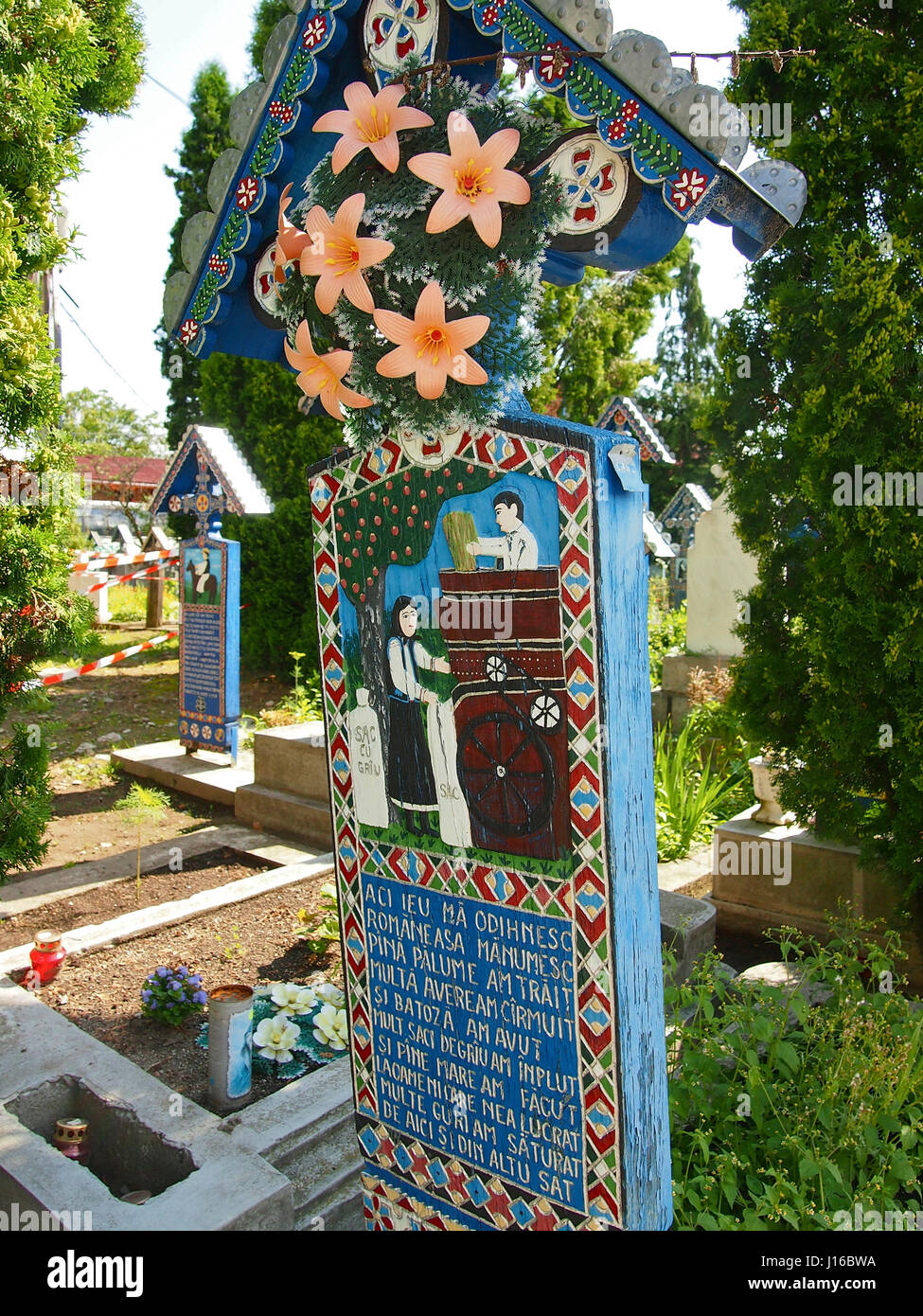 SAPANTA, ROMANIA: Bizarre headstones at the Merry Cemetery shows both ...