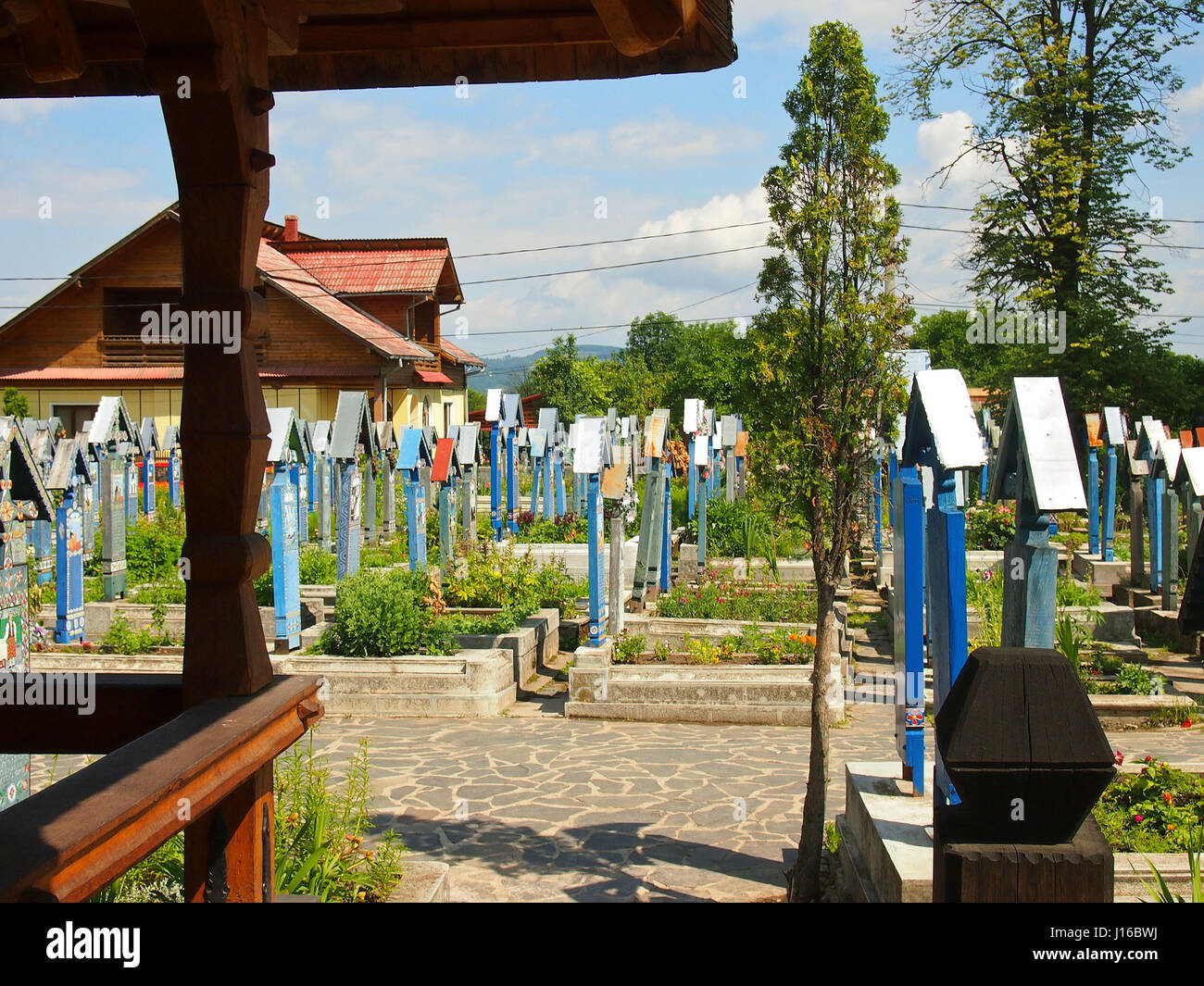 SAPANTA, ROMANIA: Bizarre headstones at the Merry Cemetery shows both ...