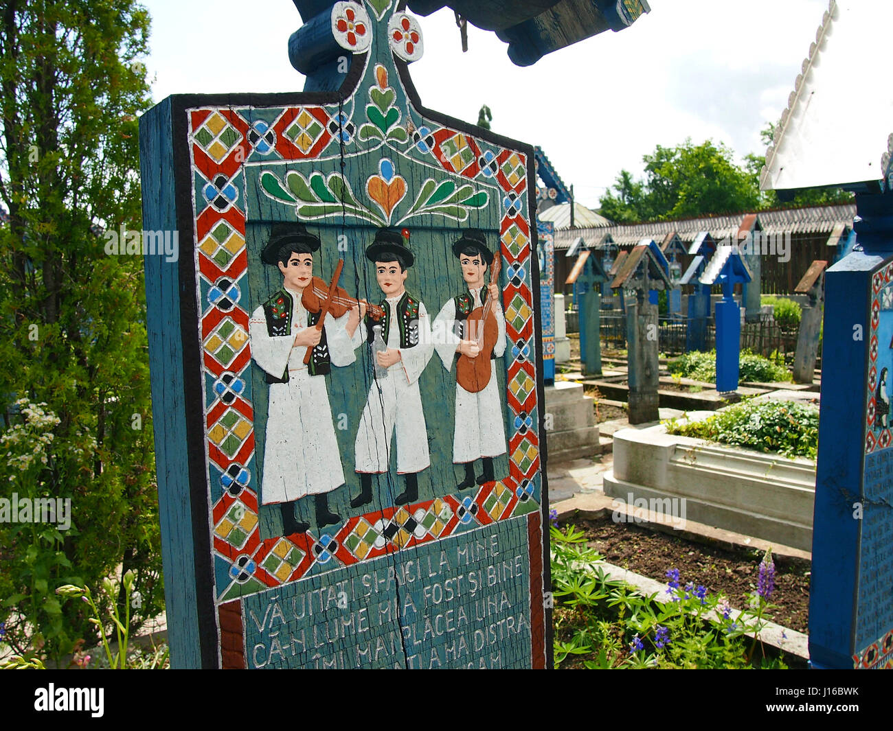 SAPANTA, ROMANIA: Bizarre headstones at the Merry Cemetery shows both ...