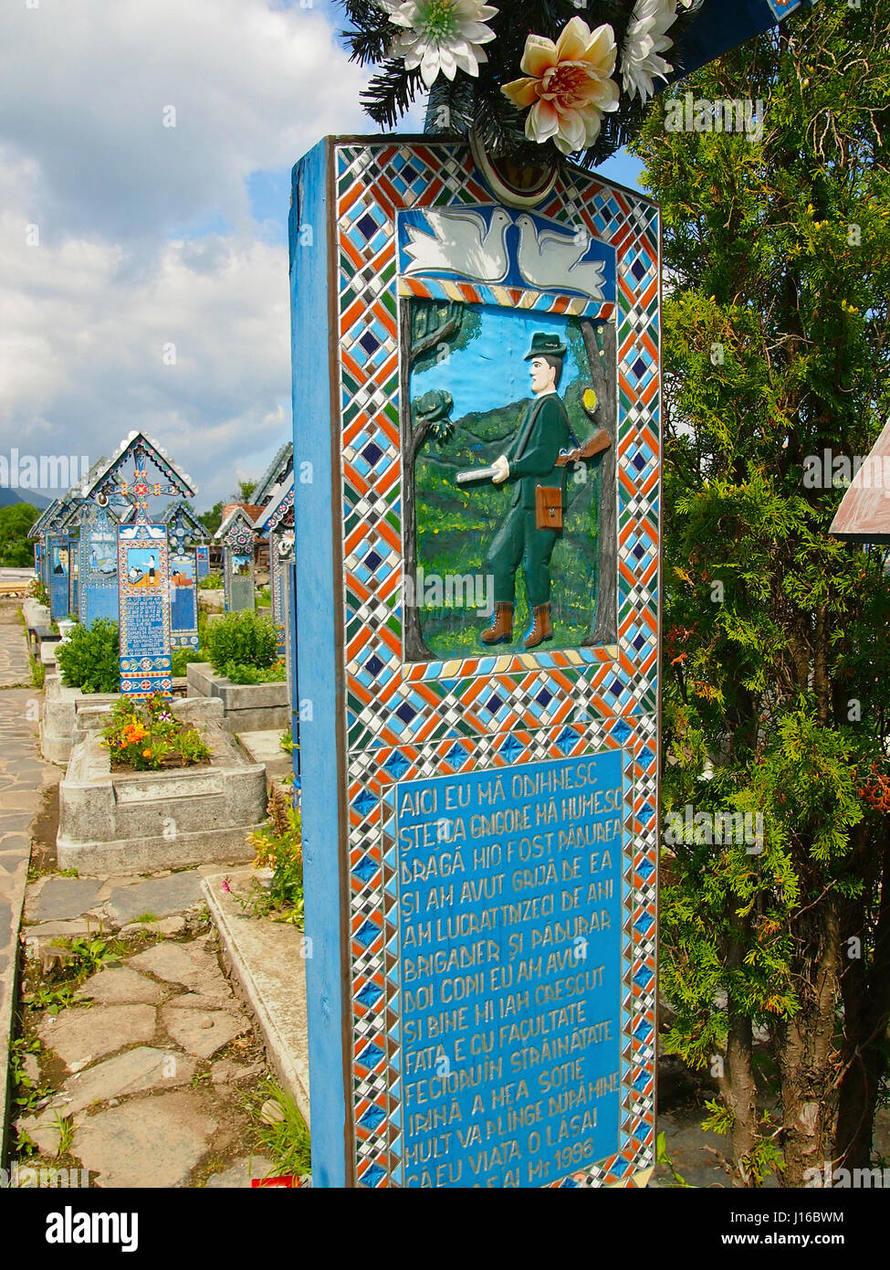 SAPANTA, ROMANIA: Bizarre headstones at the Merry Cemetery shows both ...