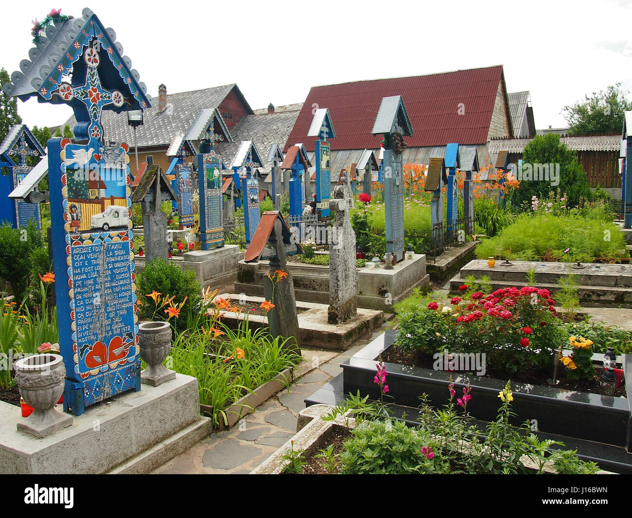 SAPANTA, ROMANIA: Bizarre headstones at the Merry Cemetery shows both ...