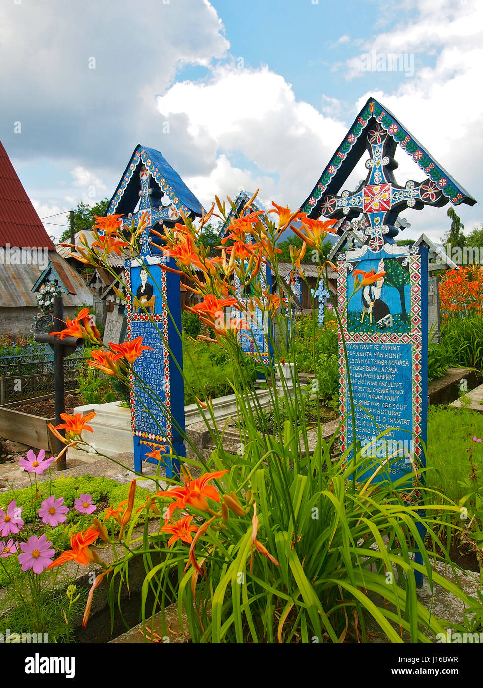 SAPANTA, ROMANIA: Bizarre headstones at the Merry Cemetery shows both ...