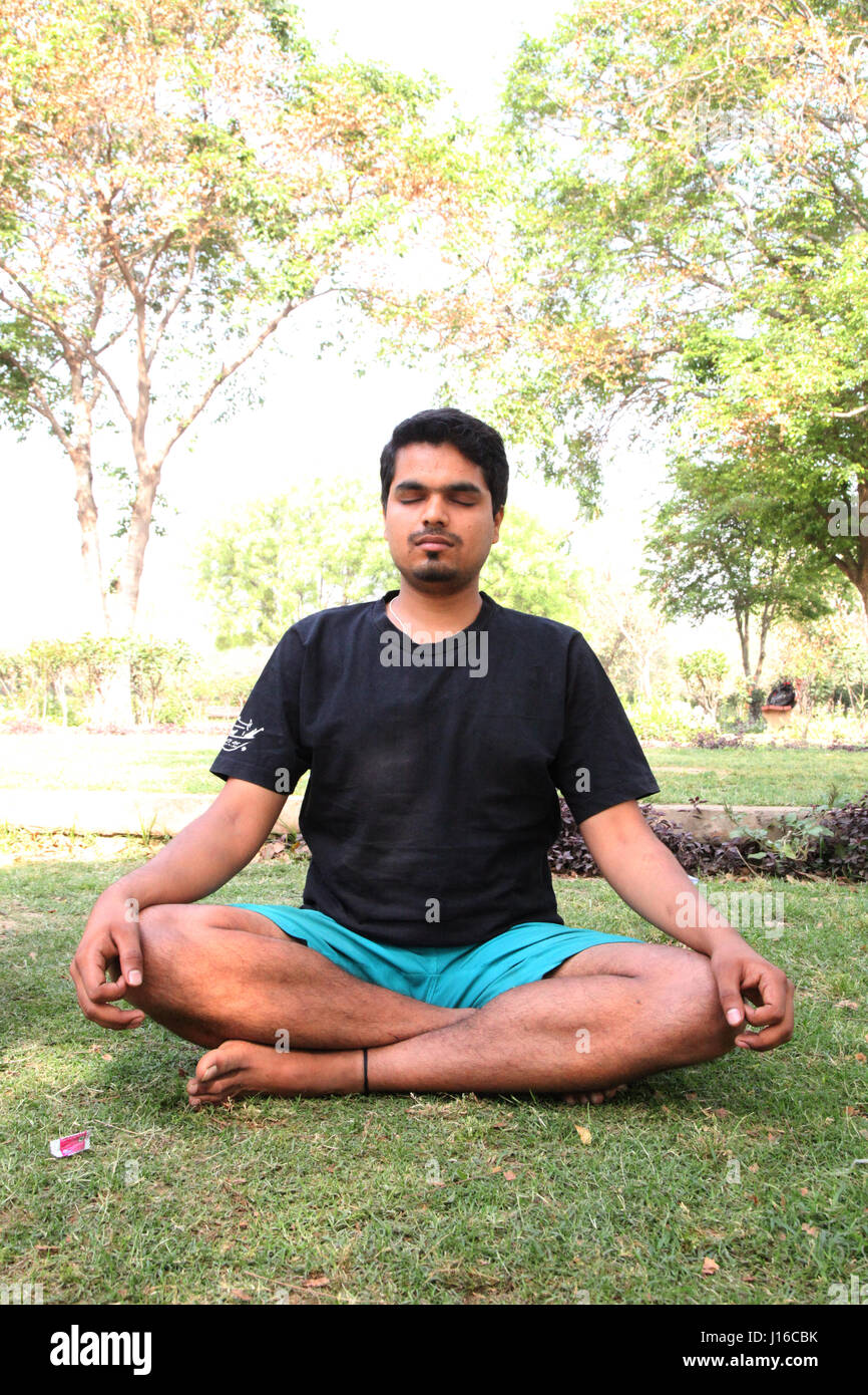 Focused Indian Guy Doing Yoga Asanas, Meditation, Yoga, Morning Garden ...