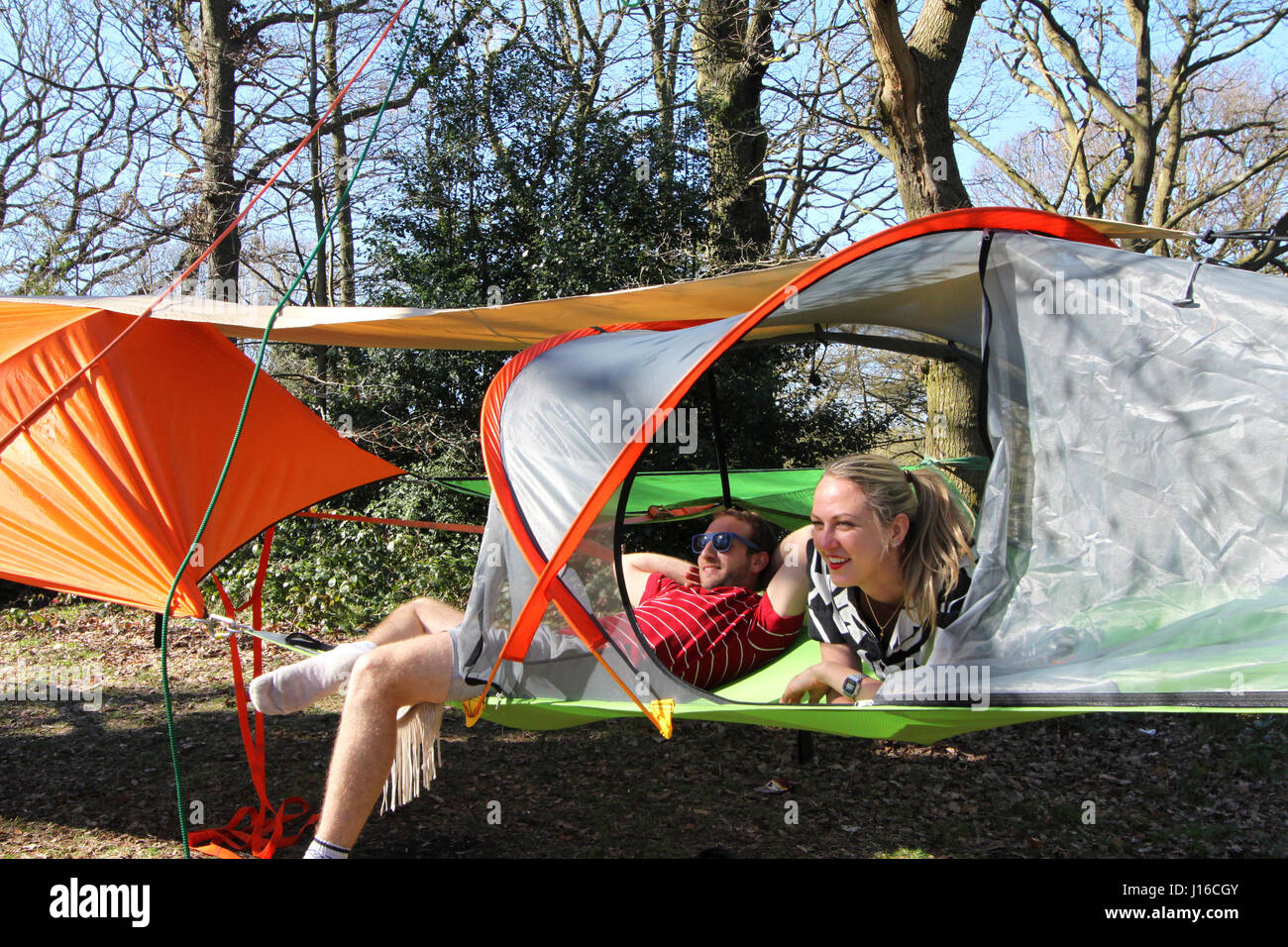 ENGLAND: Friends relax on the Tensile portable treehouse. WELCOME to ...