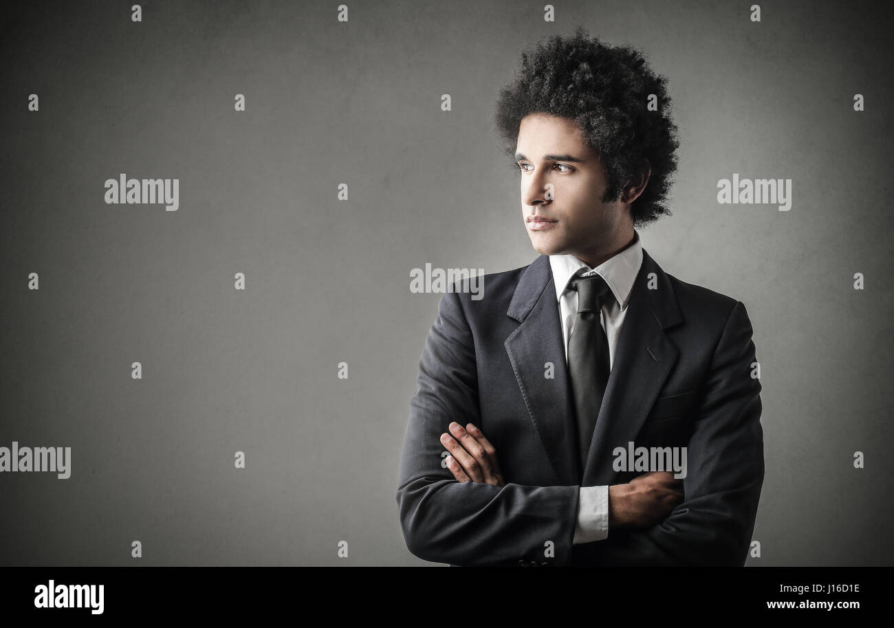 Businessman looking at the left Stock Photo - Alamy