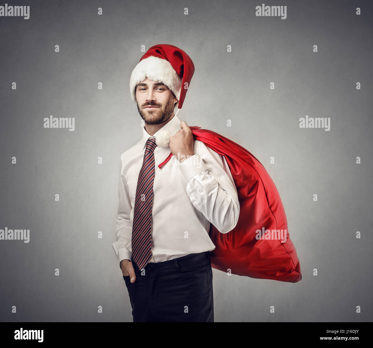 Santa holding bag Stock Photo - Alamy