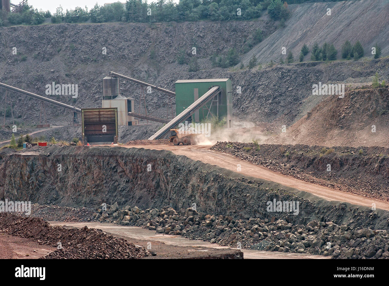 View into a quarry mine with dumper truck and earthmover Stock Photo ...