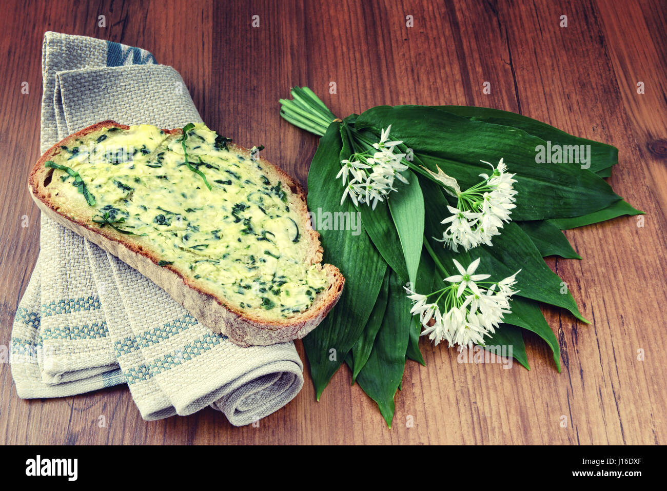 bunch of wild garlic (ramson) and bread slice with ramson butter Stock ...