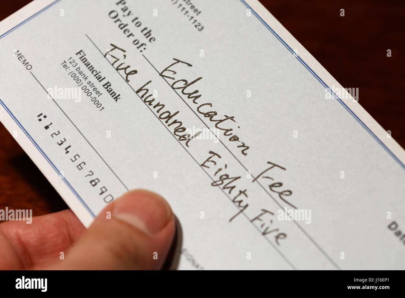 College tuition check hi-res stock photography and images - Alamy