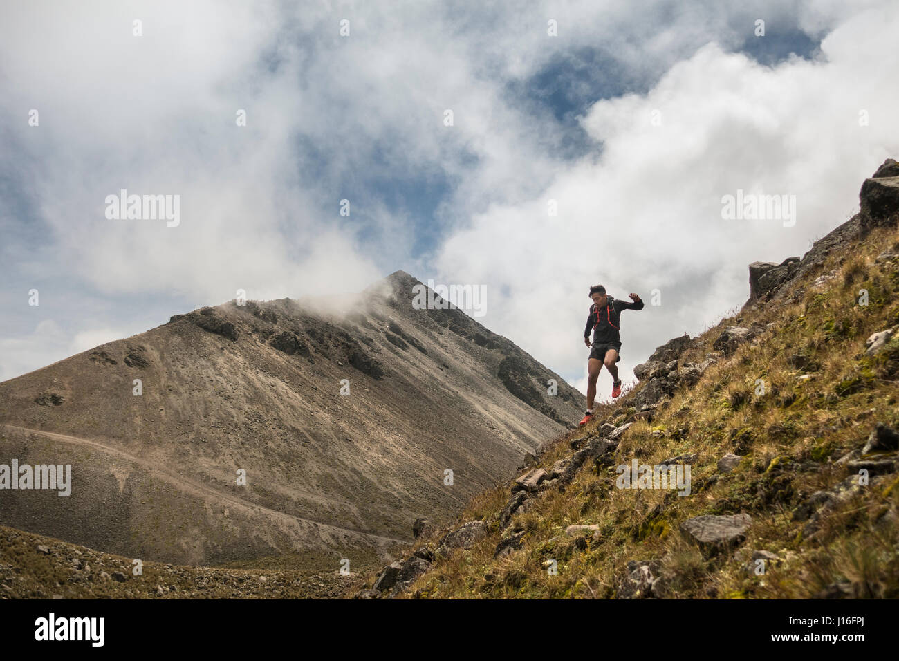 Adult running through mountain hi-res stock photography and images - Alamy