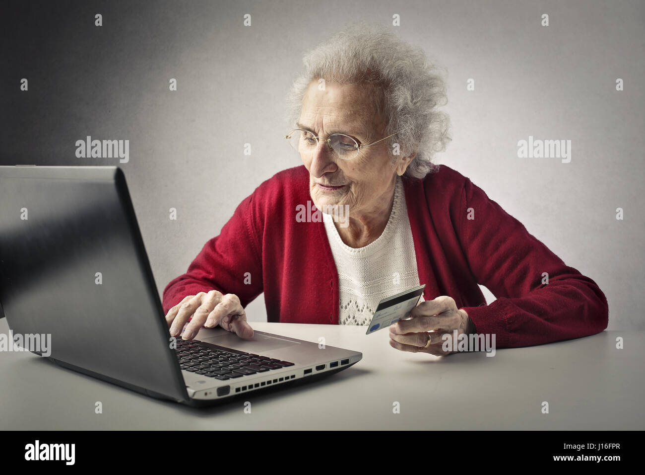 Old lady shopping online Stock Photo - Alamy