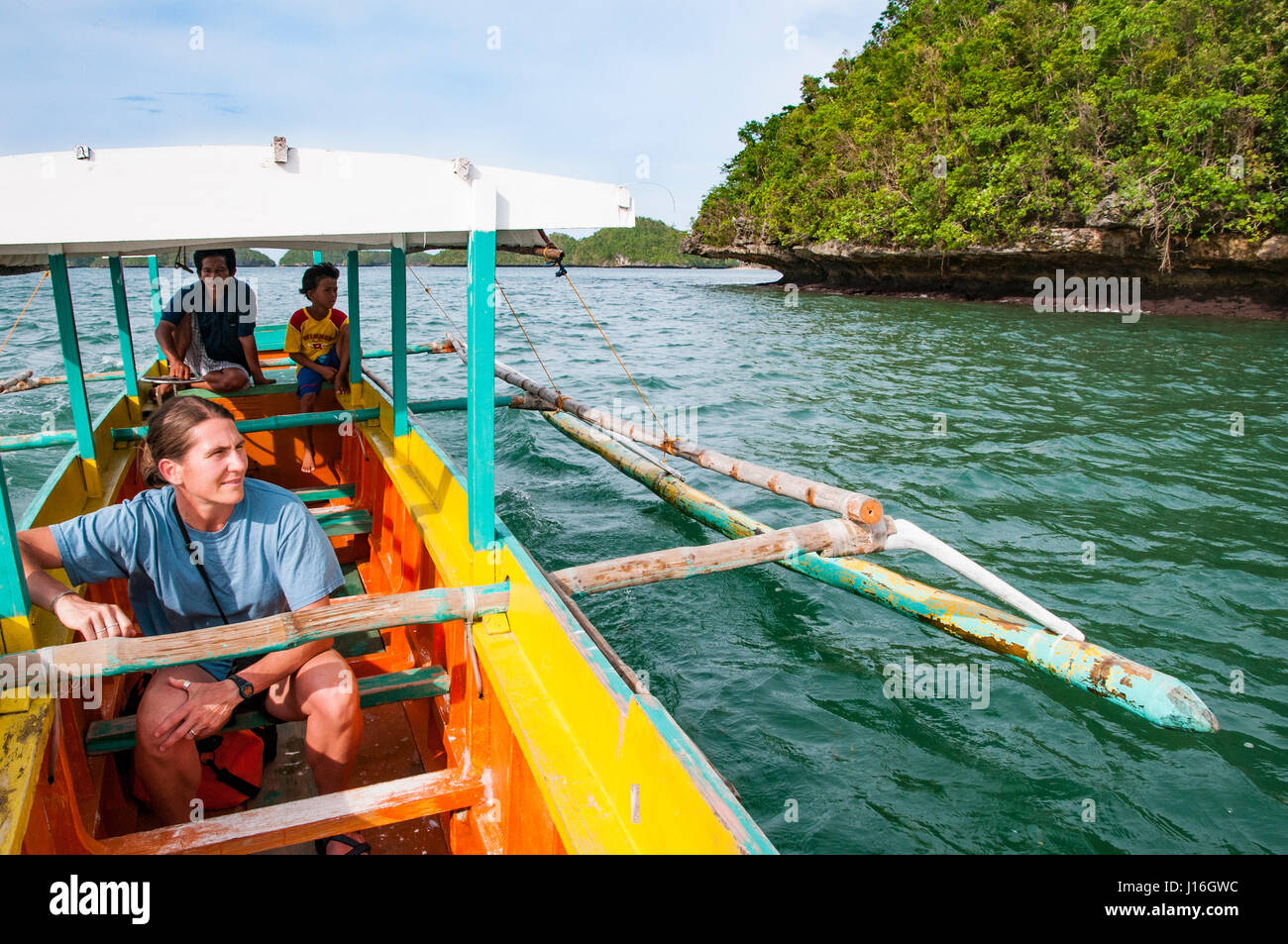 Woman Riding On Boat Through Hundred Islands National Park, Luzon ...
