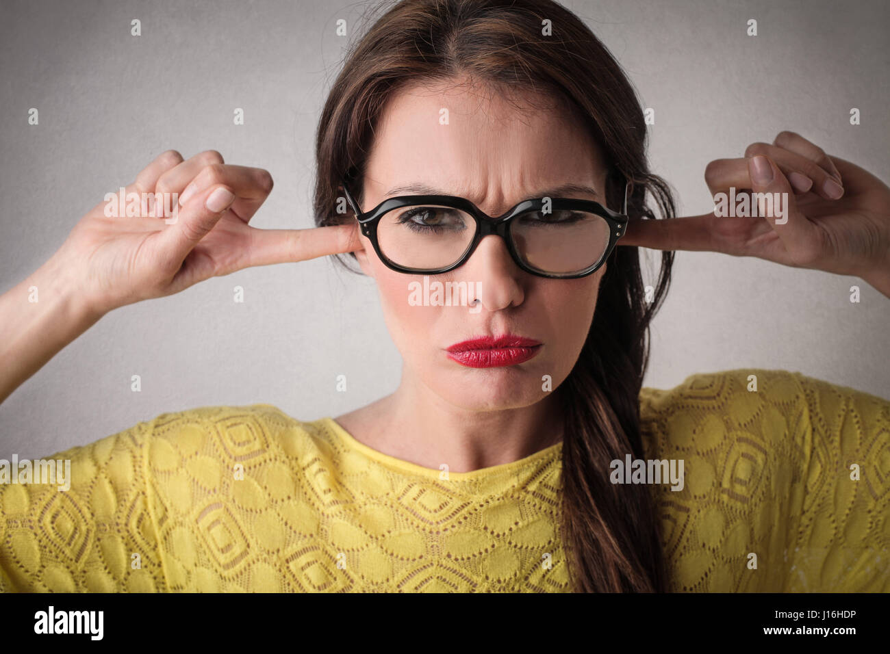 Plugging their ears hi-res stock photography and images - Alamy