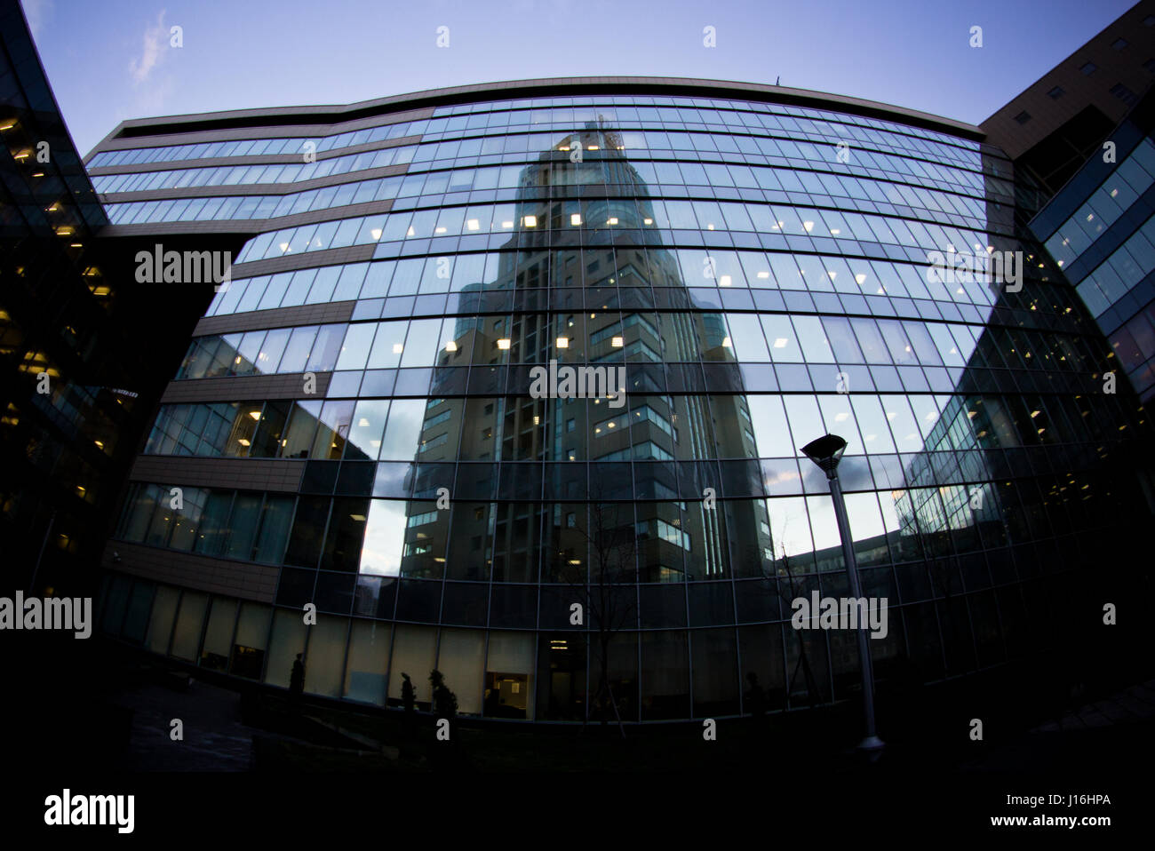 reflections of the skyscraper in the another skyscraper Stock Photo - Alamy
