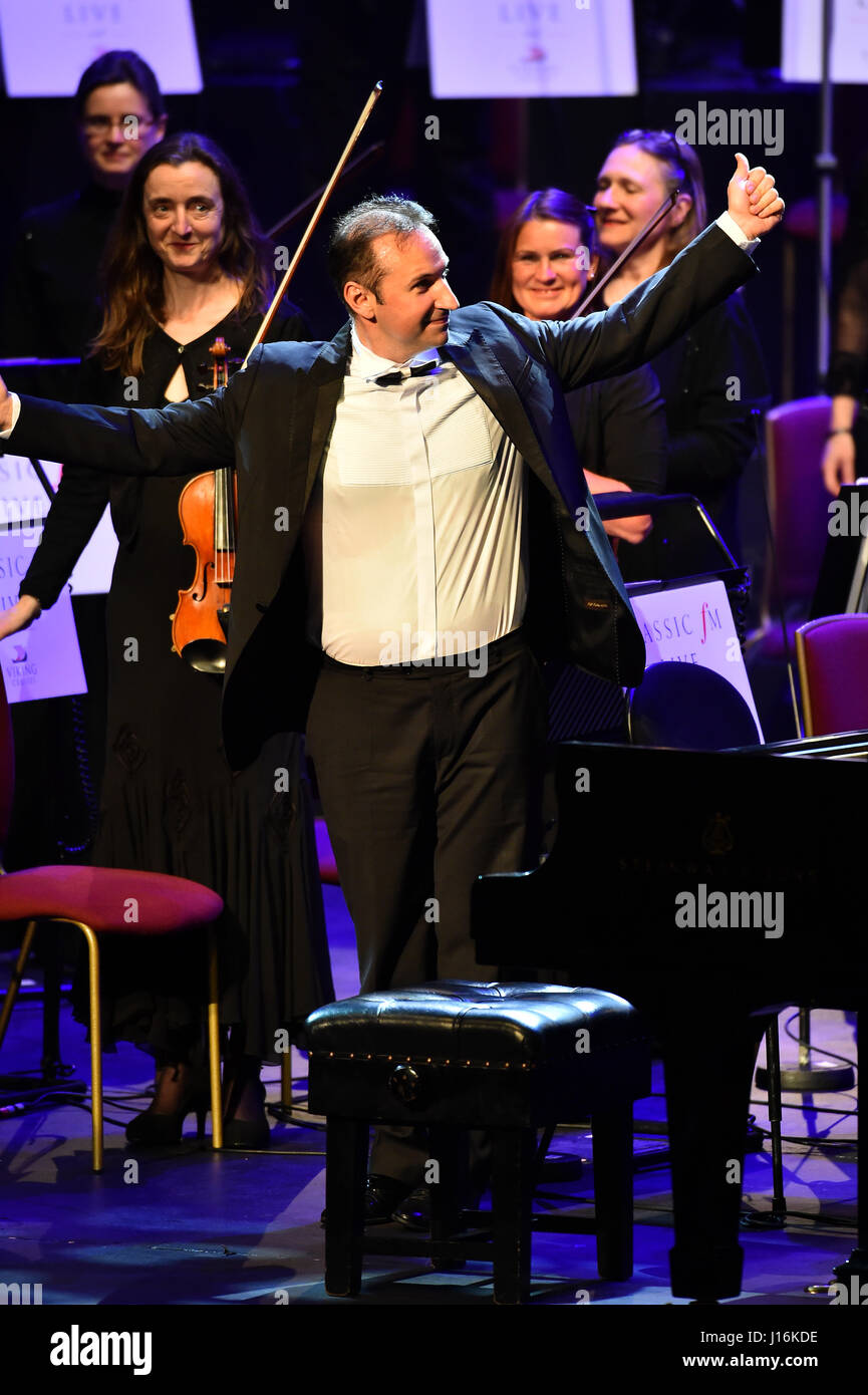 Pianist Simon Trpceski takes a bow after he performs with The ...